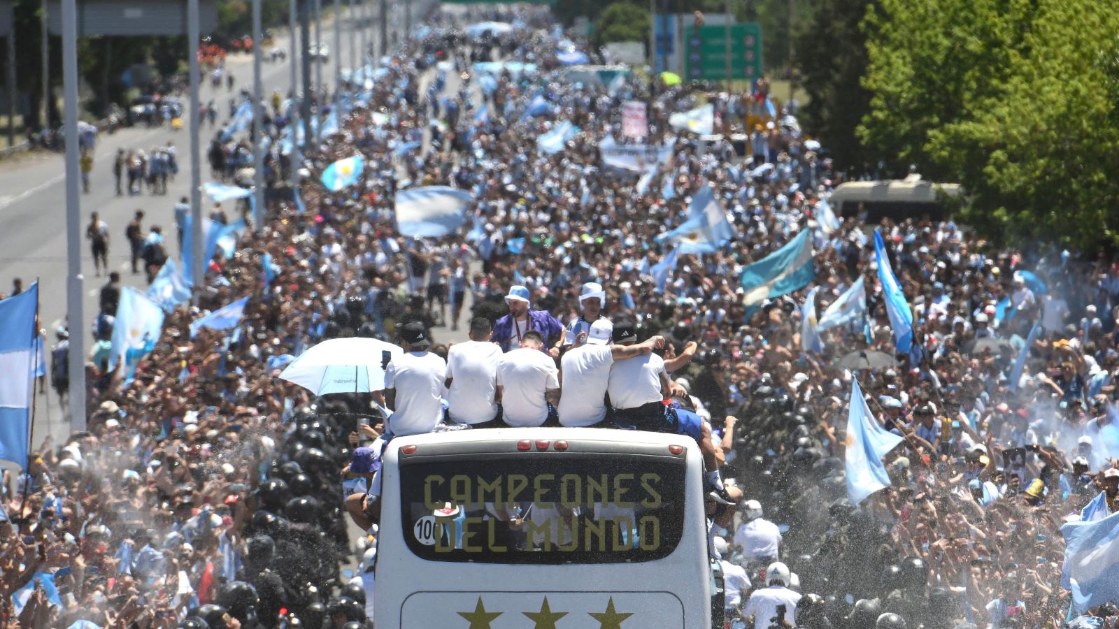 Argentina forced to swap bus for helicopters as fans swarm streets ...